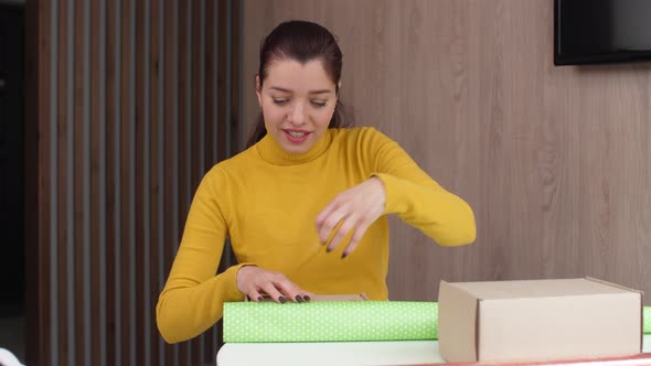 Girl at Home Fiddling with Gifts, Stock Footage | VideoHive