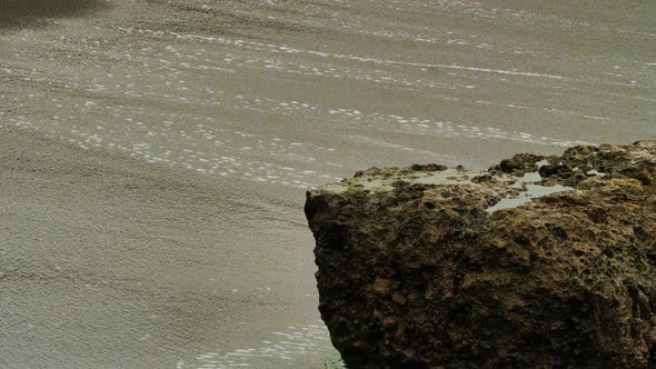 Static close-up shot of the sea waves hitting the sand and rocks, Stock ...