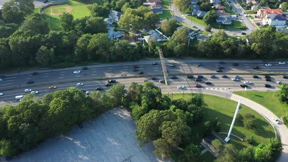 An aerial view of a parkway in the evening at rush hour. The camera ...