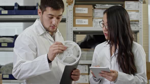 Technicians Working in Warehouse, Stock Footage | VideoHive
