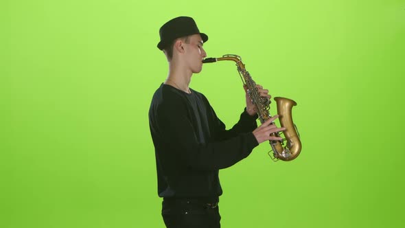 Saxophonist Playing on the Gold Musical Instrument. Green Screen, Stock ...