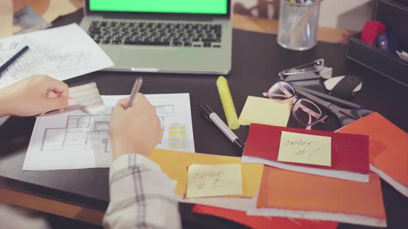 Top View of the Hands of the Designer Reformating the Data on the ...