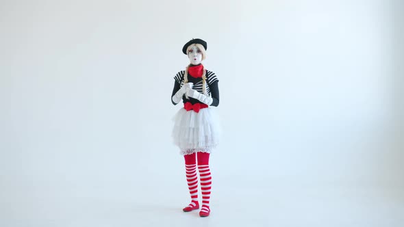 Female Mime Staring at Camera Feeling Fear Then Screaming and Hiding on ...