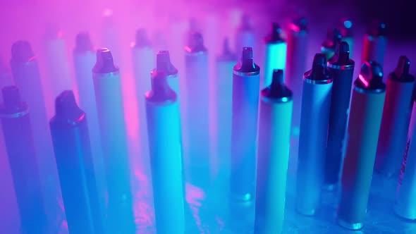 ECigarettes and Vapes with Smoke in Neon Lighting, Stock Footage ...