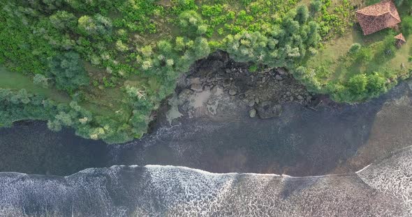 Sliding drone shot of waves hit the cliff. Cliff border with sea. The ...