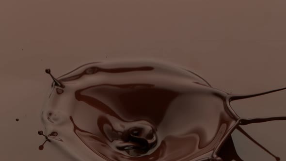 Super Slow Motion Detail Shot of Melted Chocolate Crown Splash at 1000 ...
