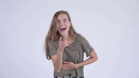 Happy Young Beautiful Woman Laughing and Pointing at Camera, Stock Footage