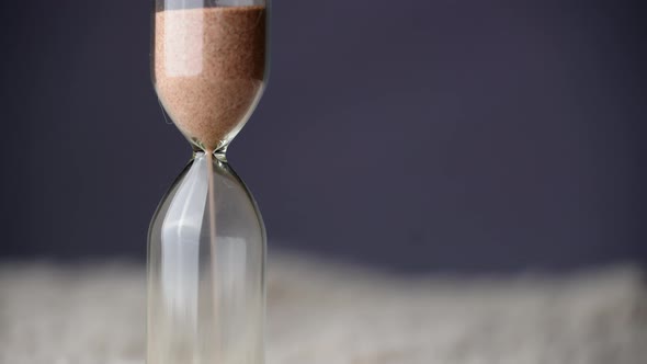 Countdown Hourglass Pouring on Purple Background, Stock Footage | VideoHive