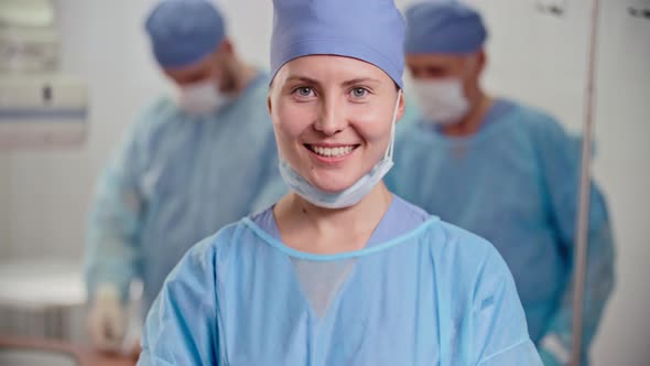 Pretty Surgeon Smiling in Operating Room, Stock Footage | VideoHive