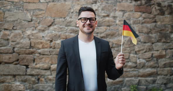 Slow Motion Portrait of Smiling German Man with National Flag of ...