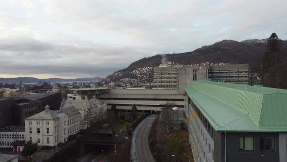 Haukeland university hospital in city of Bergen Norway - Upwarding aerial with tilt down over ...