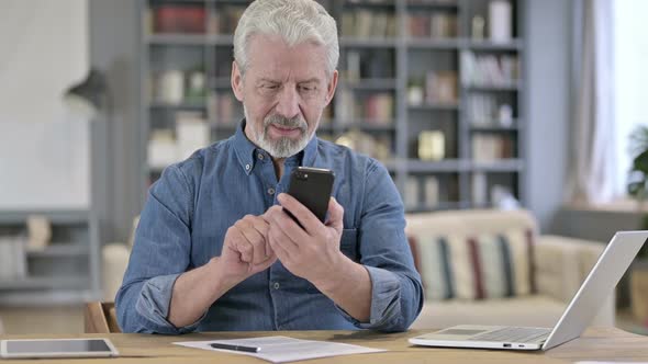 Old Man Using Smartphone in Modern Office, Stock Footage | VideoHive