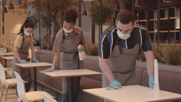 Three Restaurant Workers Wiping Tables, Stock Footage | VideoHive