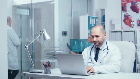 Doctor Typing an E-mail, Stock Footage | VideoHive