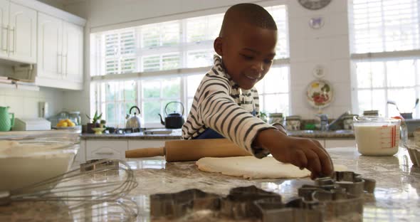 Young boy making Christmas cookies at home 4k, Stock Footage | VideoHive