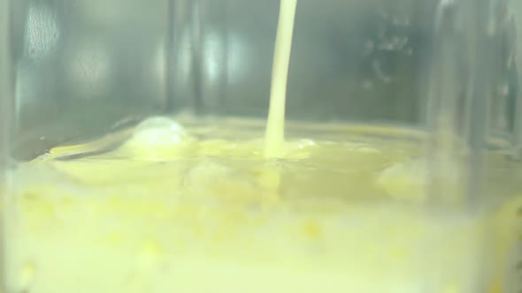 Milk is Added to the Beaten Eggs Into the Mixer, Stock Footage | VideoHive