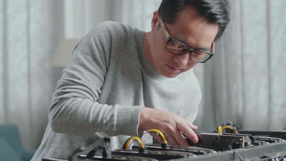 Close Up Of Asian Man Wearing Glasses Build The Mining Rig For Mining ...