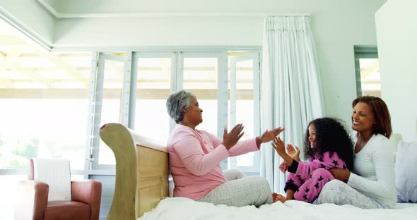 Family playing clapping games on bed in bedroom 4k, Stock Footage ...
