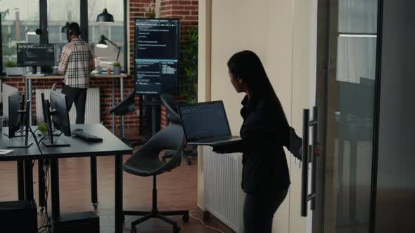 Software Developer Holding Laptop With Source Code Algorithm Entering Programmers Agency Office