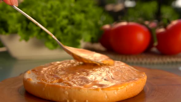 Spoon Smears the Sauce Onto a Hamburger Bun, Stock Footage | VideoHive