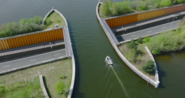 Aquaduct Veluwemeer water bridge with boat crossing above highway ...
