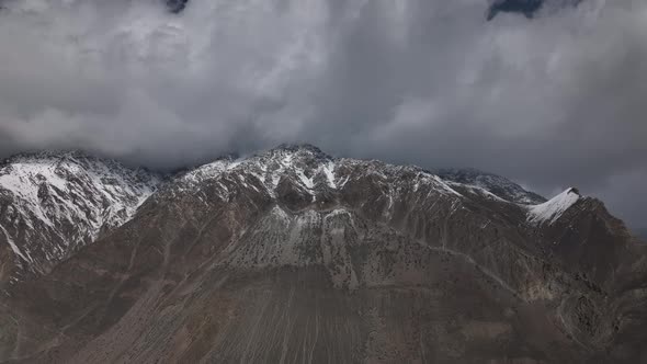 Ominous Clouds Above Peaks Of Snow Covered Mountains In Hunza, Pakistan ...