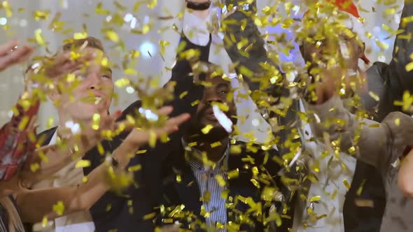 Close-up Happy Company Play with Confetti, Stock Footage | VideoHive