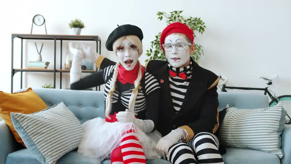 Female Mime Pushing Guy While Watching TV Then Getting Present Hugging ...