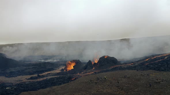 Aerial view around crowd near bubbling magma craters in Geldingardalur ...