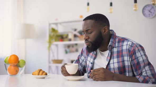 African-American Male Drinking Coffee, Coughing After Chocking With ...