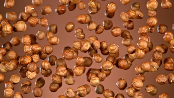 Super Slow Motion Shot of Flying Hazelnuts After Being Exploded on ...