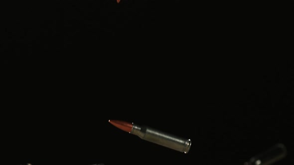 Bullets falling bouncing in ultra slow motion , Stock Footage | VideoHive