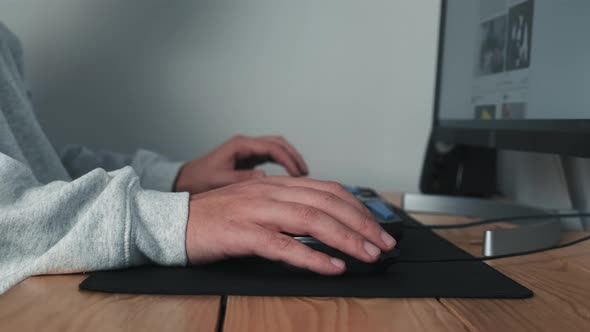 Closeup of a Man's Hands Controlling a Computer Program Using a Mouse ...