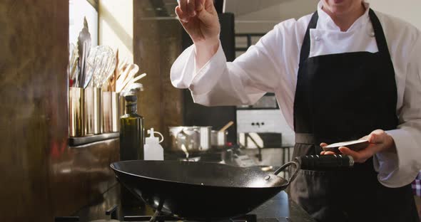 Chef adding salt on the vegetables, Stock Footage | VideoHive