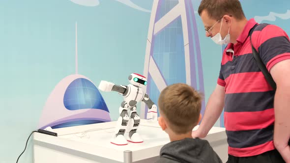 The father shows his son modern robots., Stock Footage | VideoHive