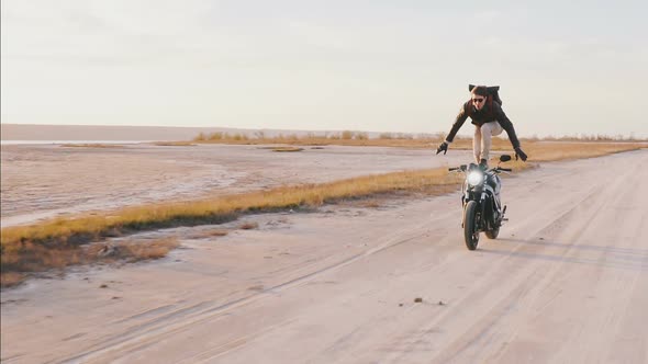 Motorcyclist Surfing on His Motorbike on High Speed on the Road During ...