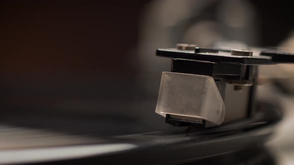 Dropping Stylus Needle On Vinyl Record Playing With Disc Rotating Close ...