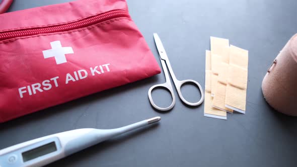 Close Up of First Aid Kit and Thermometer on Black, Stock Footage ...