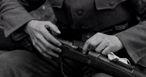 World War II German Soldier Cleaning Rifle, Stock Footage | VideoHive