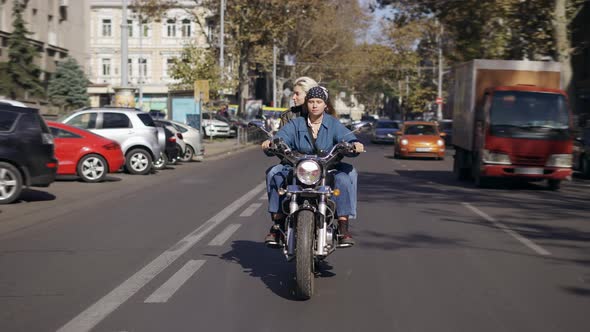 Two European Women Riding Motorcycle By the City Street Front View ...