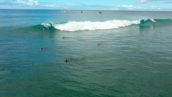 Aerial view of bodysurfer riding a wave at Point Panic in Oahu Hawaii ...