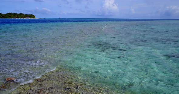 Tropical fly over abstract shot of a summer white paradise sand beach ...