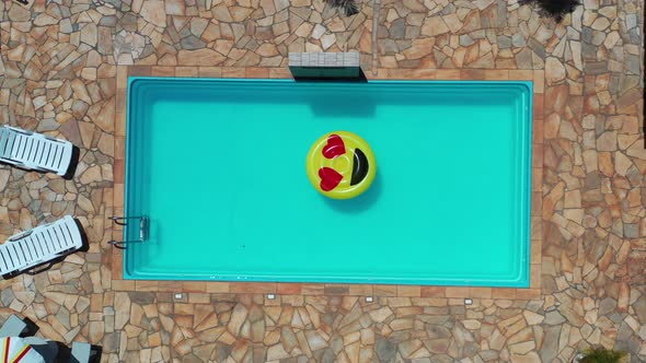 Smile emoji icon floating at swimming pool at countryside, Stock Footage