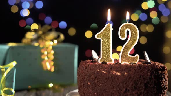 Number Twelve Birthday Candle on a Sweet Cake on the Table 12Th ...