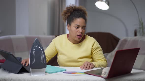 Anxious Stressed African American Woman Typing on Keyboard on Laptop ...