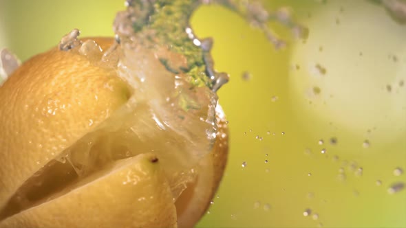 Fresh Lemon Fruit Squirting with Juice in Slow Motion in Green Nature ...
