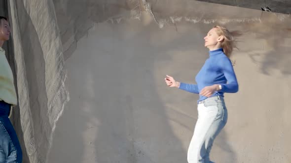 Two Girls Meeting After Long Time War Running Into Each Other with Open ...