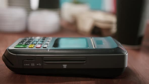 Customer Paying a Merchant with Mobile Phone with NFC Technology Woman ...