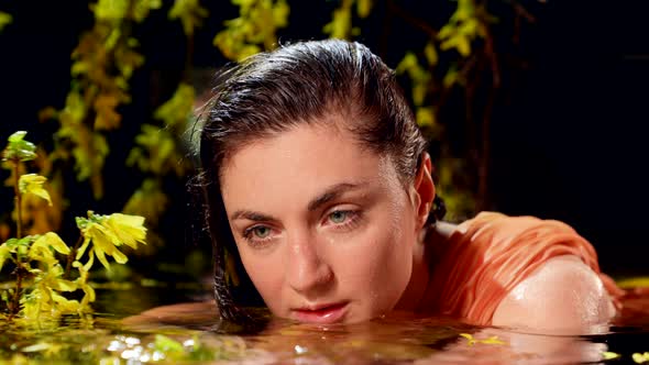 Fabulous Water Nymph is Bathing in Magical River with Beautiful Yellow ...