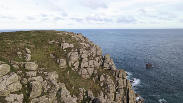 Drone flying over rocky promontory of Minack in Cornwall. Aerial ...